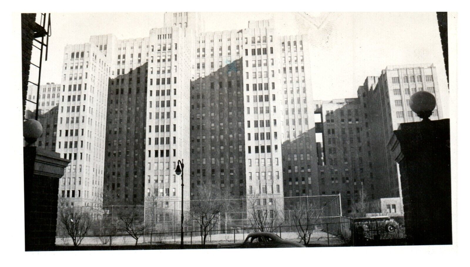 1950s Urban Skyscraper Architectural View Vintage Photo – techrewinds