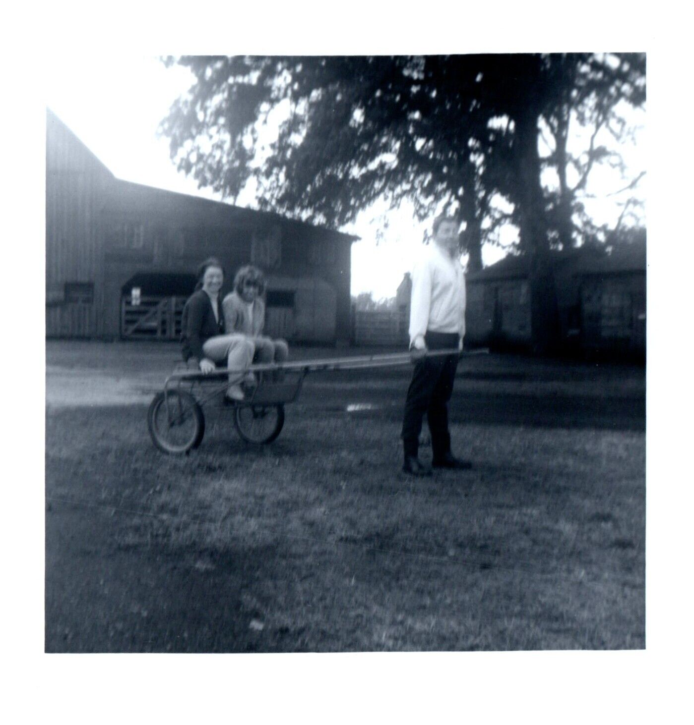 1940s Man Carrying Two Girls Vintage Snapshot Photo – techrewinds
