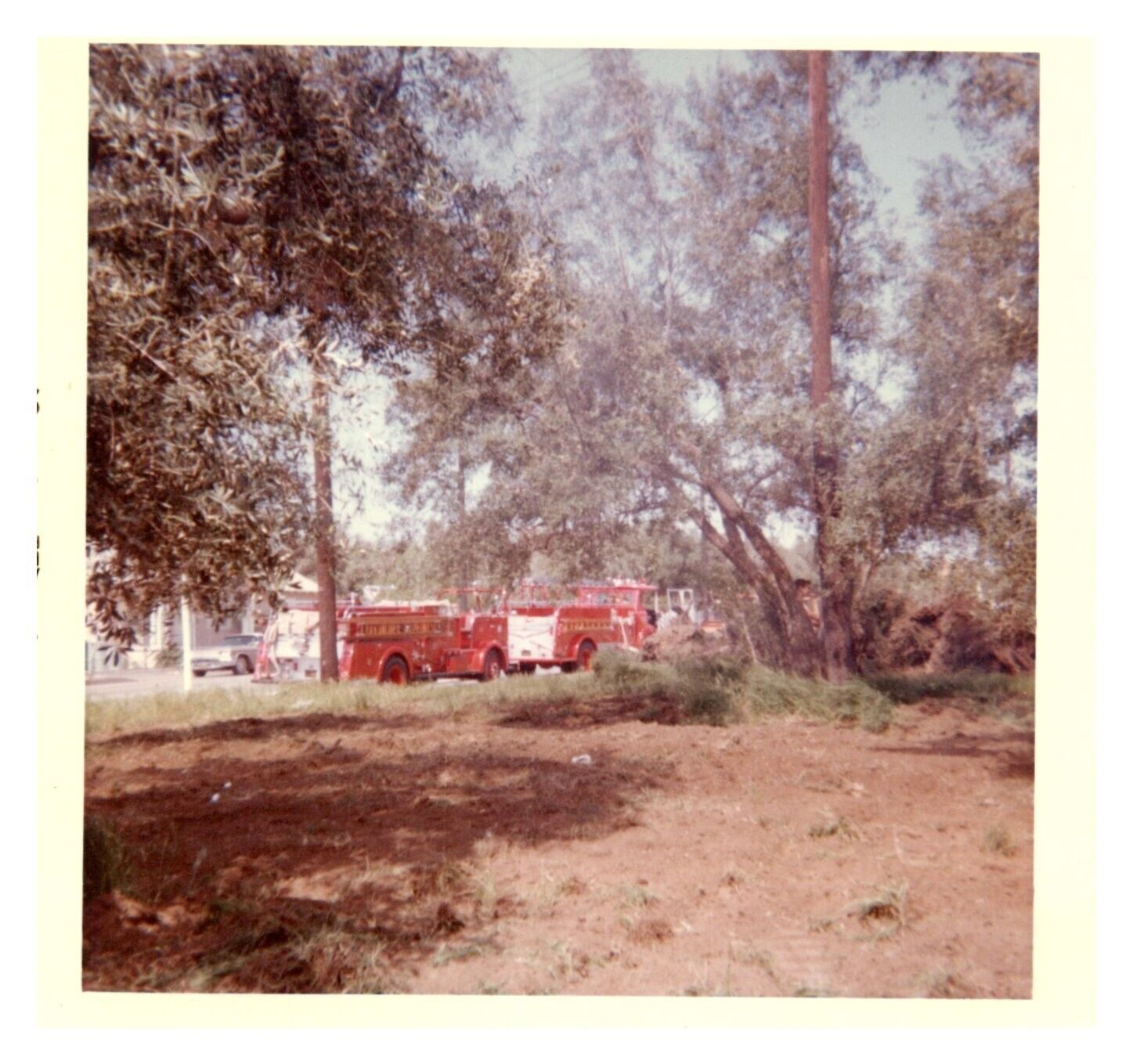 1970s Firefighter Bus in the Distanst Vintage Photo – techrewinds